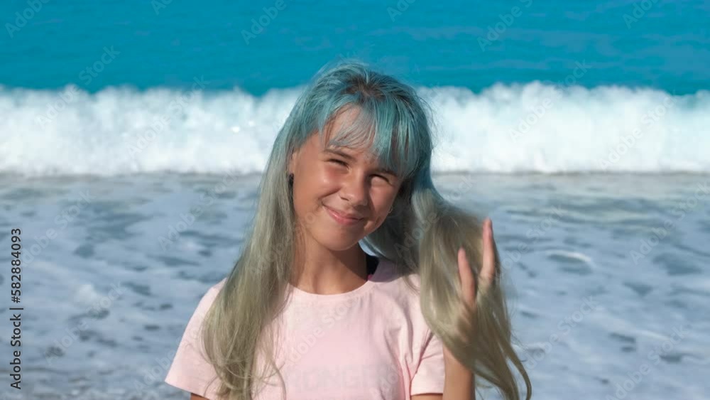 Smiling teen during island vacation. A view of joyful teen girl with ...
