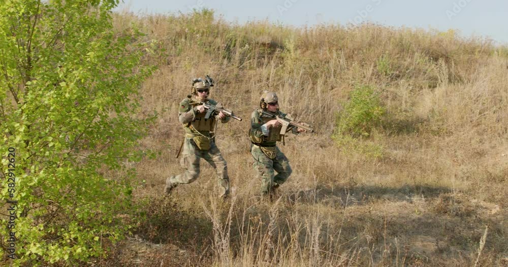 young soldiers running to attack Enemy. Armored Soldiers in Helmets ...