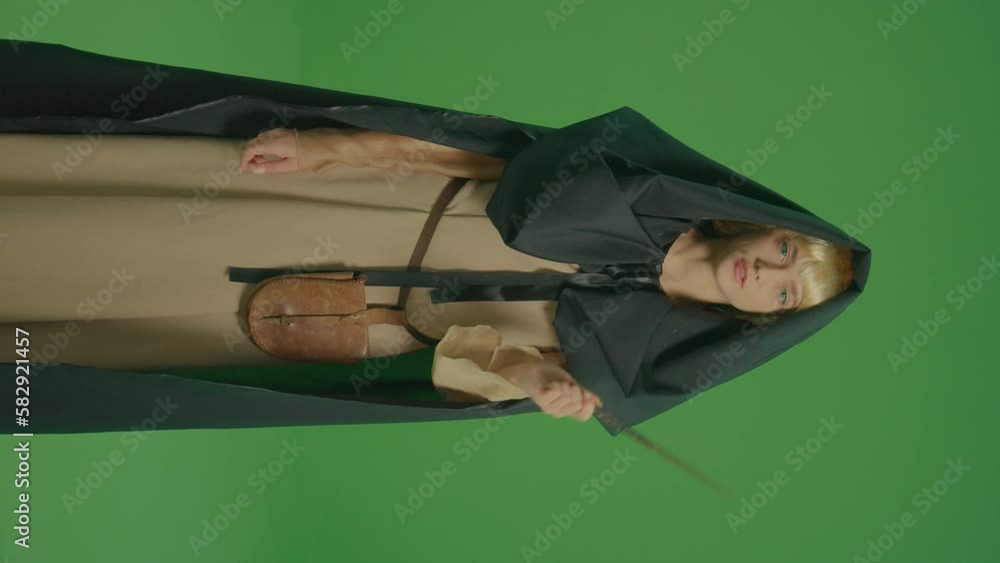 Vertical View.Green Screen.Serious Woman Sorceress Dressed in a Cloak ...
