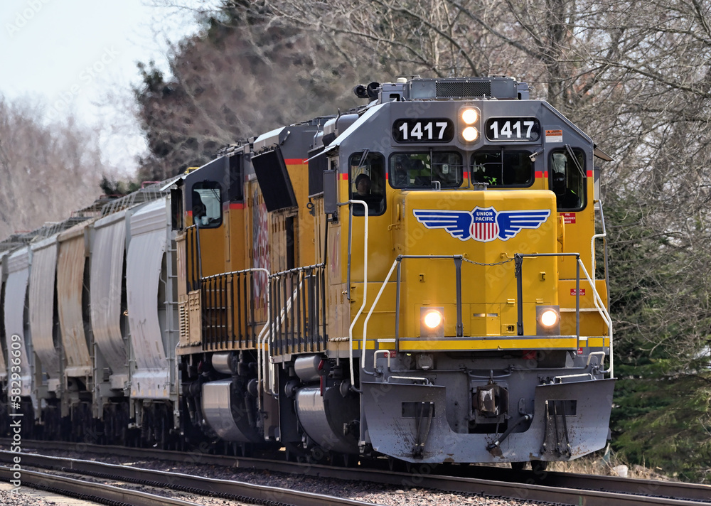 Two Union Pacific locomotives power a local freight train through ...