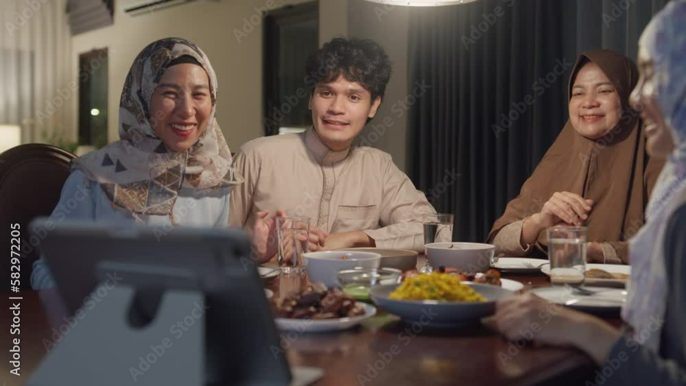 Happy Asian muslim family celebrate long distance with cousin video ...