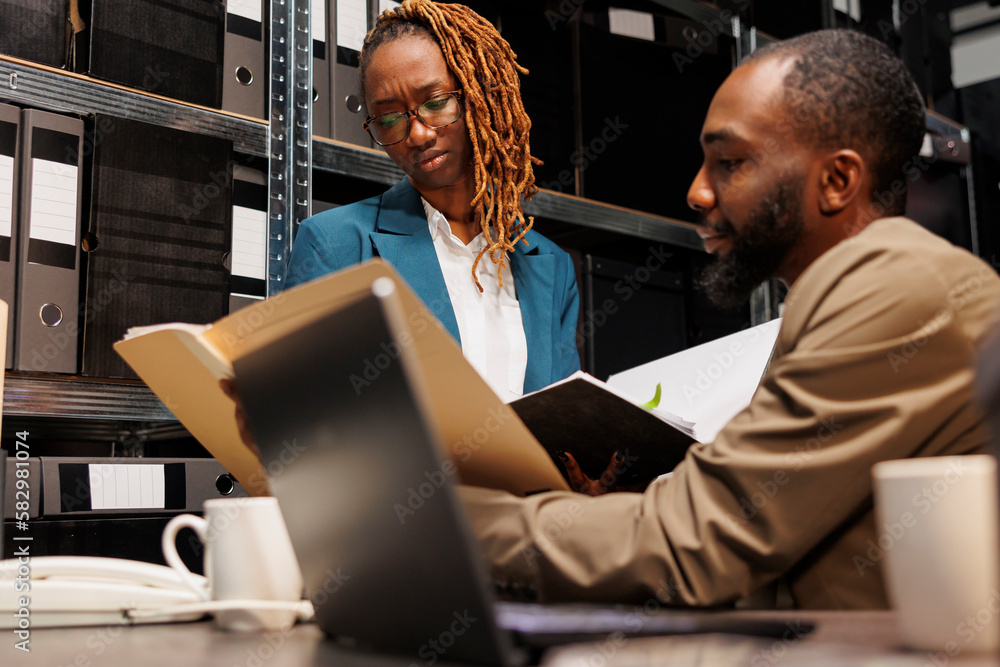 Woman and man detectives collaborating to solve case in police ...