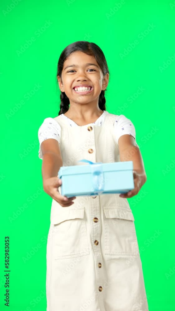 Girl child, box and gift by green screen studio in with smile ...