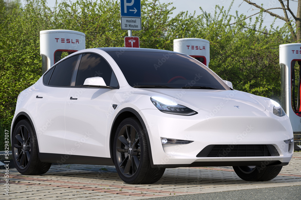 Tesla Model Y Long Range at the charging station. Stock Photo | Adobe Stock