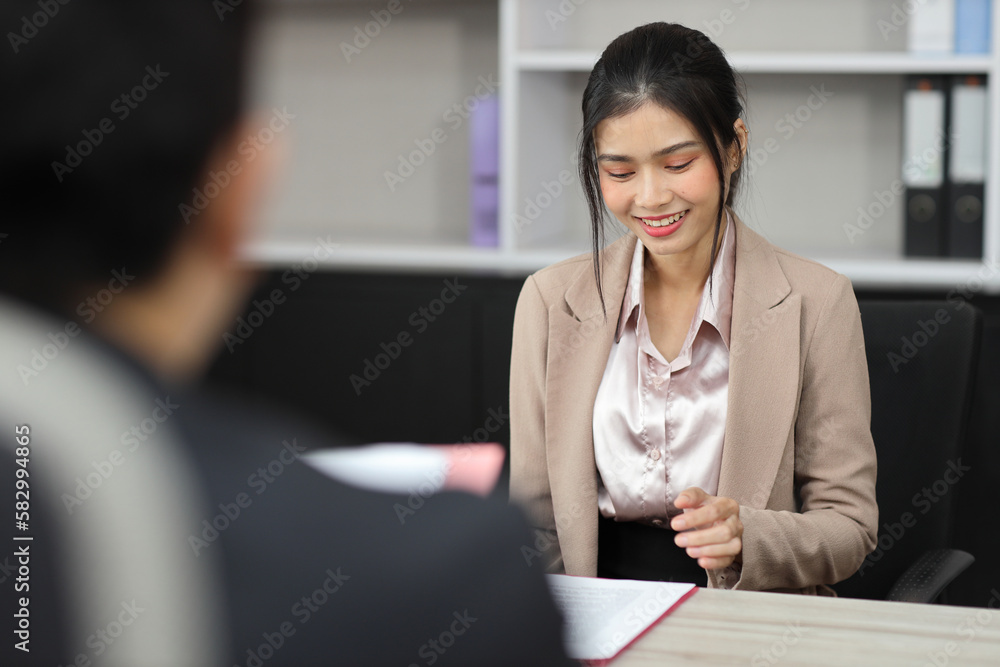 Human resources department managers sitting and interviewing female ...