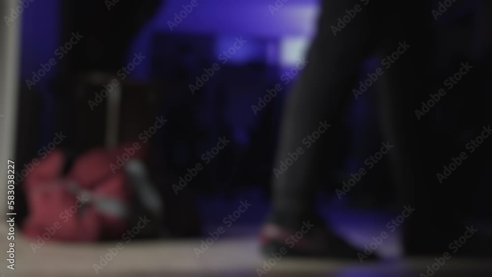 Football players change clothes in dark locker room before soccer match ...