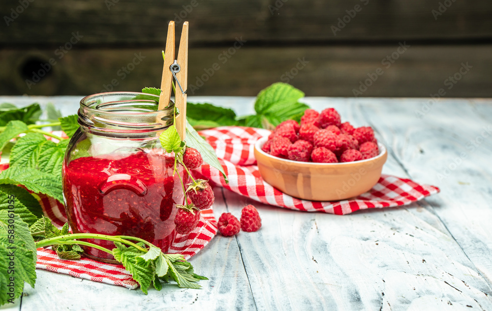 Raspberry jam with berry on light background. Homemade jam with ...