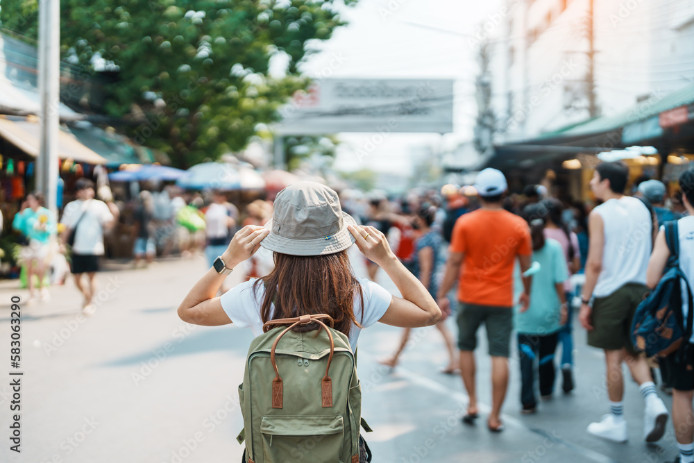 woman traveler visiting in Bangkok, Tourist with backpack and hat ...