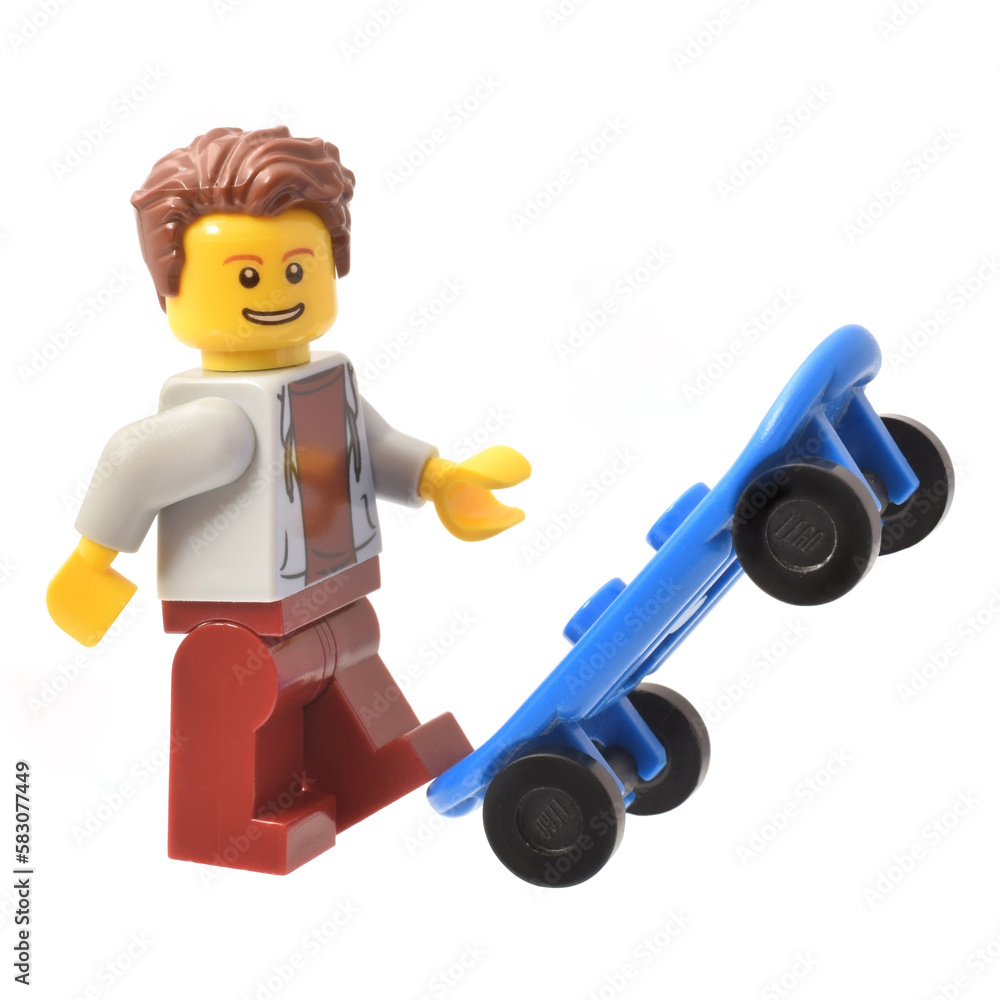Lego minifigure with skateboard cute and happy is standing closed up ...