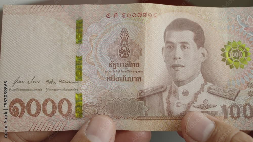 Select focus of a new version thousands Thai baht banknotes money. The ...