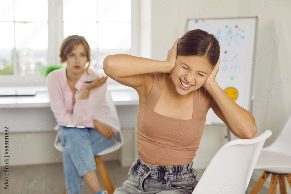 Problem child at interview meeting at psychologist office. Disobedient ...