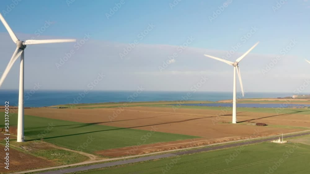 Wind turbines and solar panels farm in a field. Renewable green energy ...