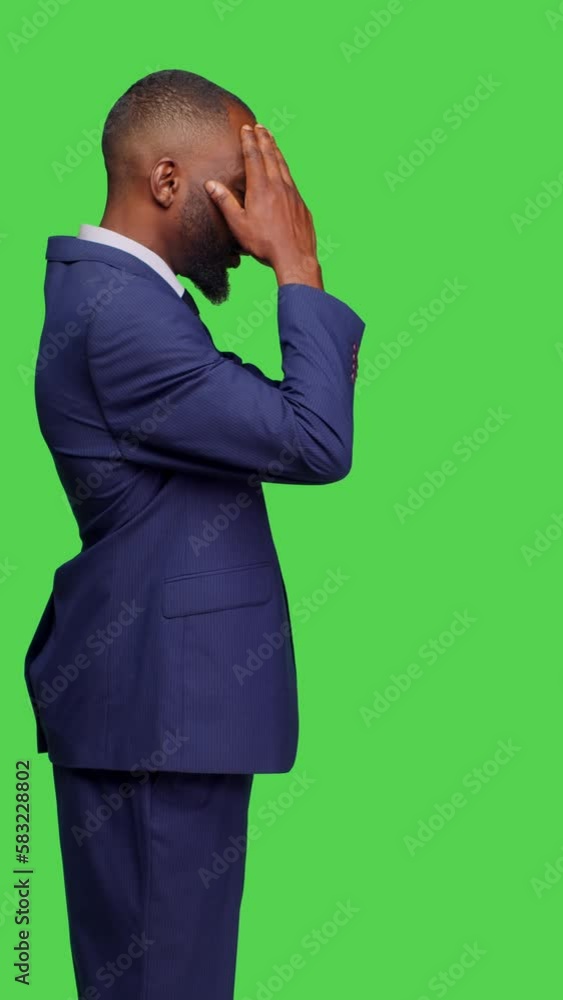 Vertical video: Profile of stressed young adult feeling frustrated on ...