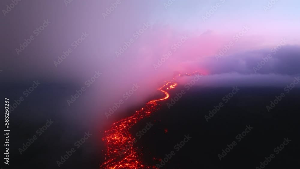 Cinematic magnificent lava river at active volcano eruption. Glowing ...