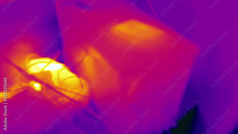 An object as seen on an infrared camera with the orange color on it in ...