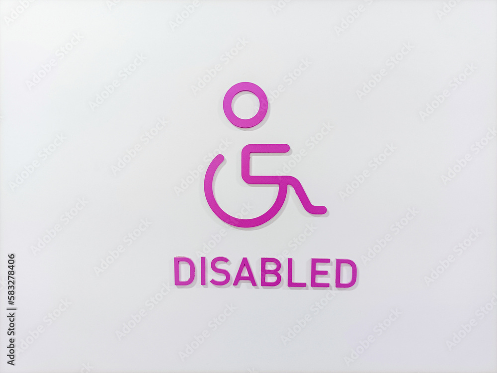 Disabled sign symbols are installed on the door to indicate a special ...