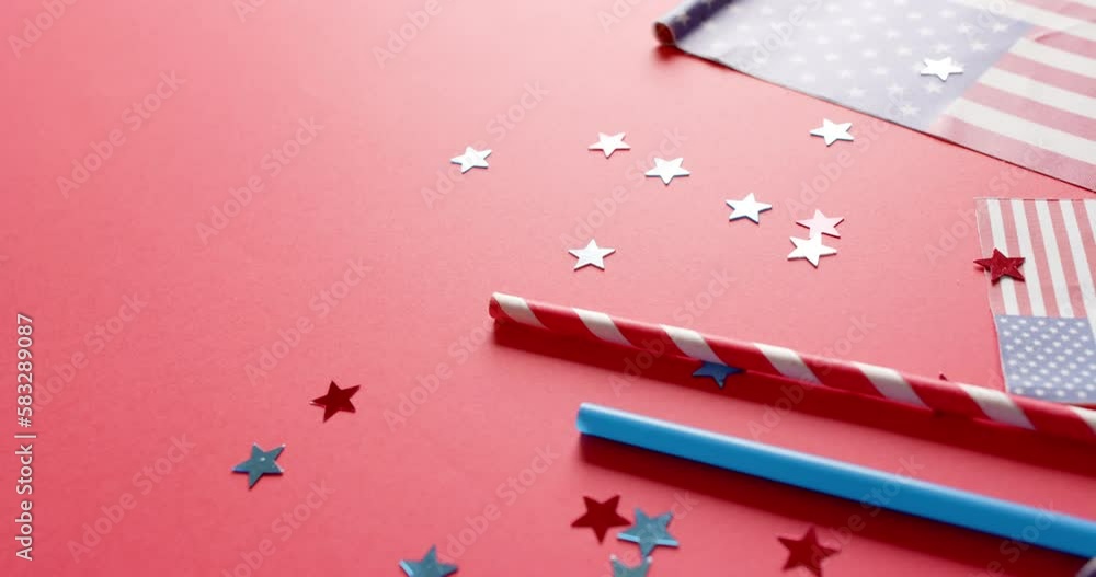 National flags of usa with stars and straws lying on red background ...