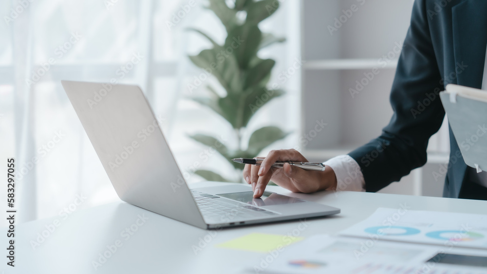 Using calculator and laptop, Close up hands of asian bookkeeper female ...