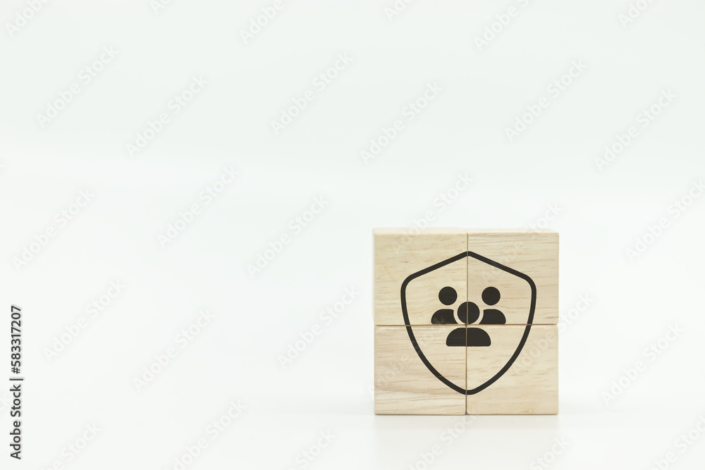 Shield and people group icons on wooden block cubes on white background ...