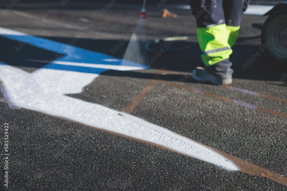 Process of making new road surface markings with a line striping ...