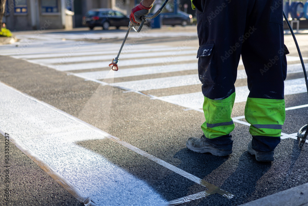 Process of making new road surface markings with a line striping ...