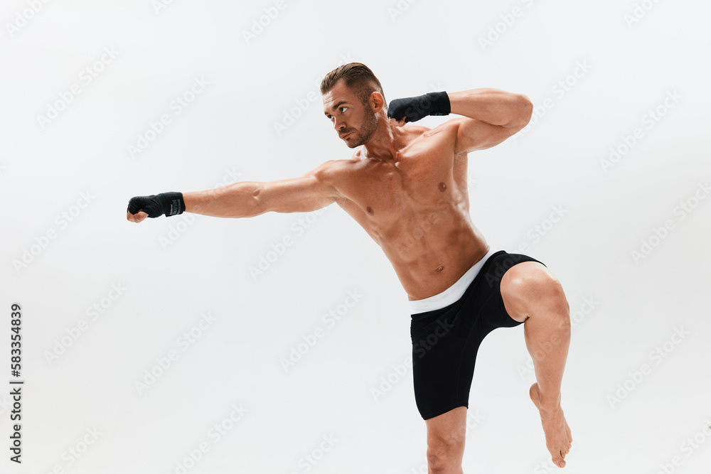 Man athletic bodybuilder poses in boxing gloves with nude torso abs in ...