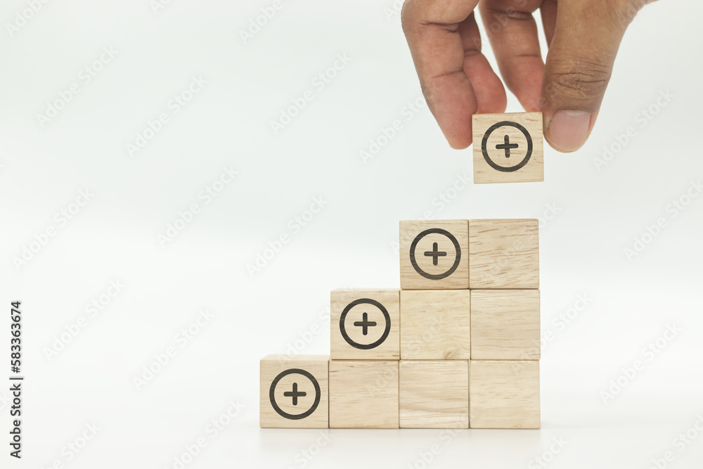 Plus sign icons on wooden block cubes shape stairs on white backgroud ...