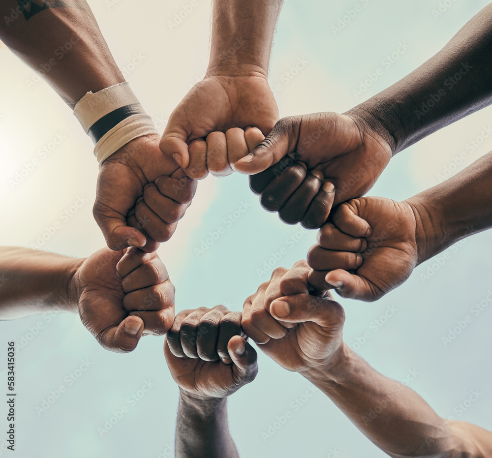 Hands, fist and unity with a sports team standing in a huddle for ...