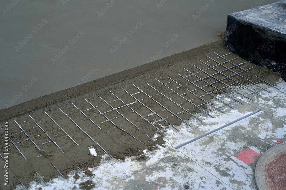 Installation of cement floor screed with rebar. Machine floor screed ...