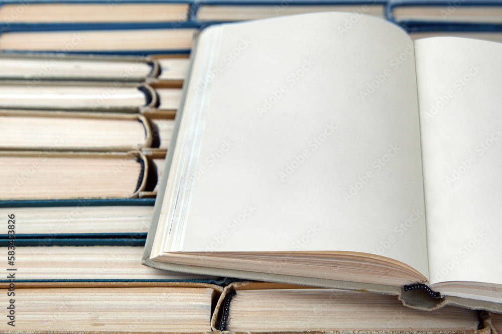 An open book diary with blank pages lies against the backdrop of shabby ... An open book diary with blank pages lies against the backdrop of shabby ...