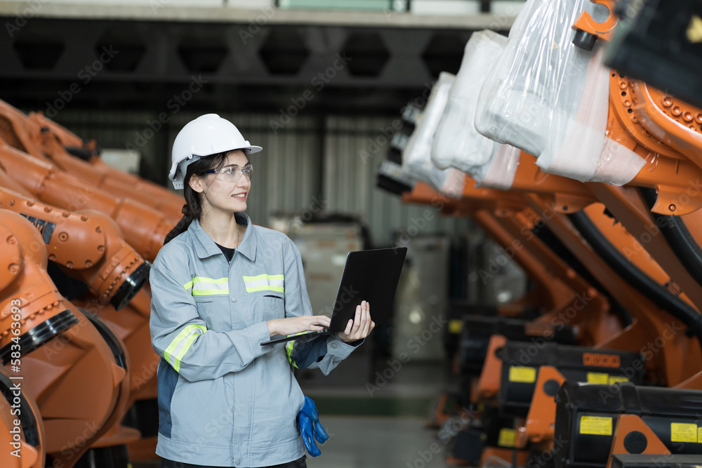 Industrial Manufacturing Robotic Arms Maintaining. Female engineer ...