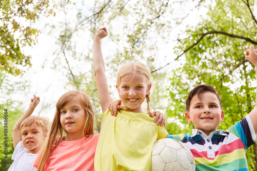 Group of kids cheering after winning a soccer game in nature Stock ...