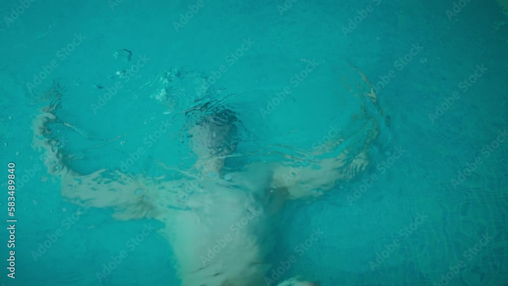 Blue water with bubbles and unrecognizable swimmer underwater in ...
