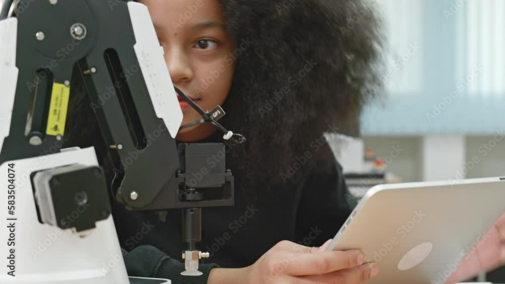 Group Kid teen child enjoy Machine Learning Robot arm is Moving Under ...