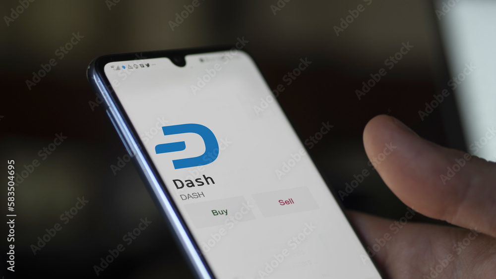 March 11 2023 London UK. An investor's analyzing the Dash coin on ...