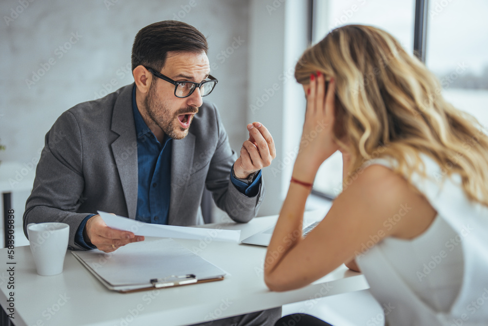 Manager is hard talking with employee in an office. Businessmen arguing ...