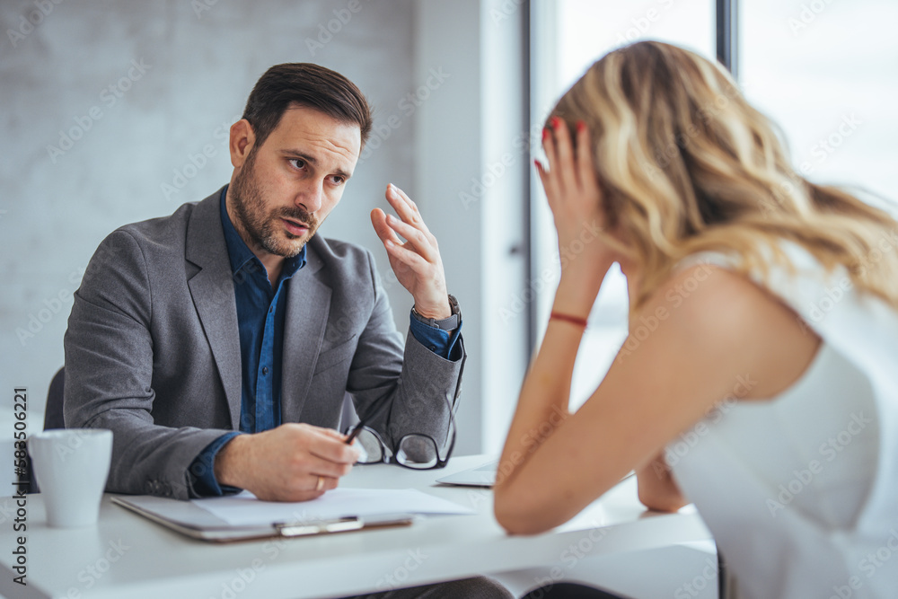Mad male worker yelling at female colleague asking her to leave office ...