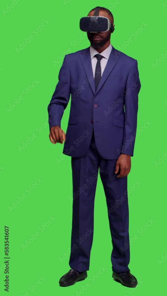 Vertical video: Front view of corporate employee using vr headset on ...