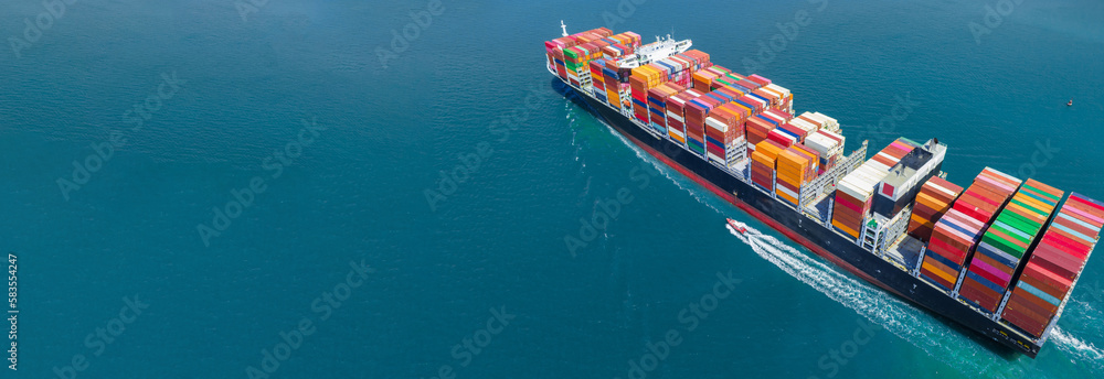 Side Ship view of Cargo Container Ship with Tug boat carrying container ...