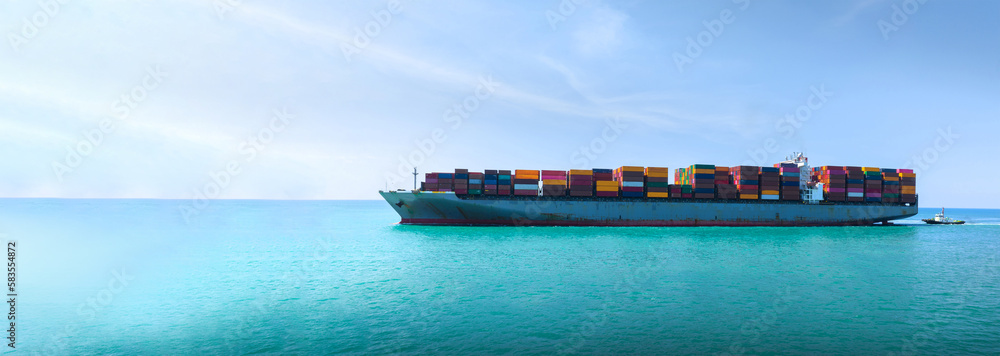 Side Ship view of Cargo Container Ship with Tug boat carrying container ...