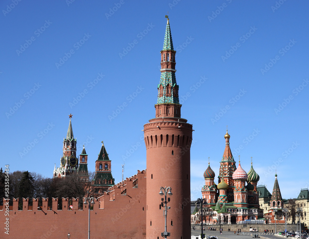 Kremlin red brick wall with towers and Intercession Cathedral on Red ...