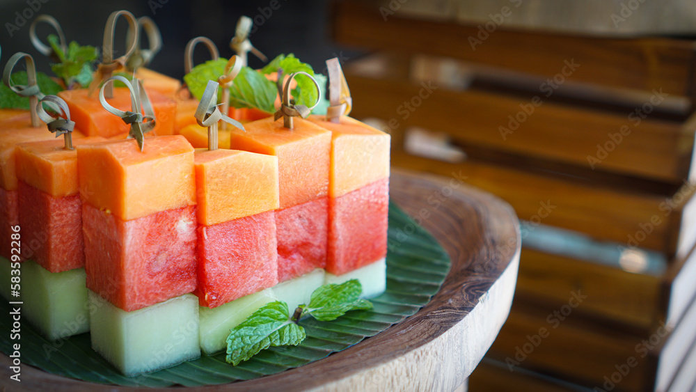 Zoom of Slice of Papaya, Watermelon and Melon fruits on the Banana ...