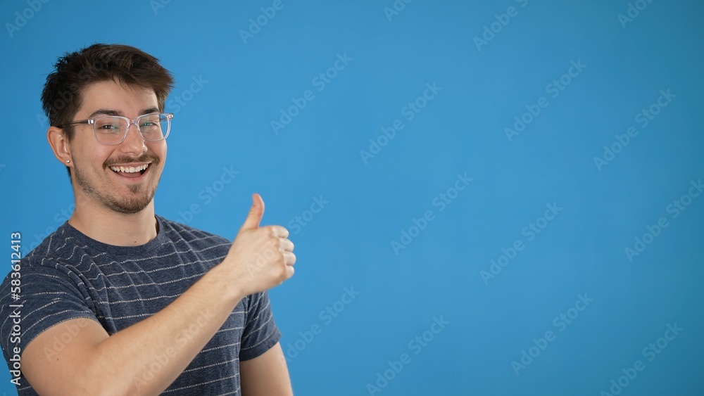 Happy promoter lively young man 20s wears striped shirt pointing ...
