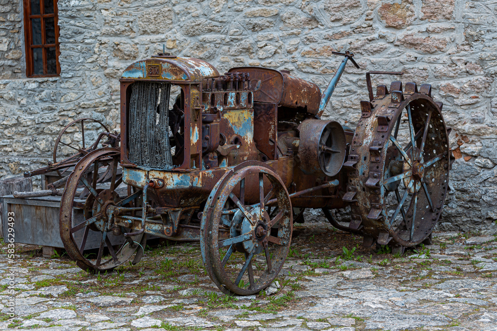 Vintage wheeled tractor. Retro machine for farming in the countryside ...