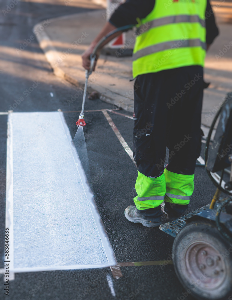 Process of making new road surface markings with a line striping ...