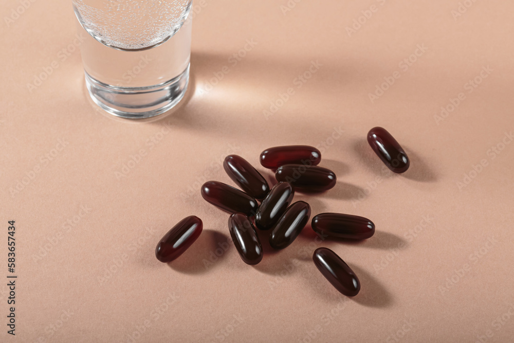 Diet, nutrition, healthy eating concept. Oil filled capsules of food ...