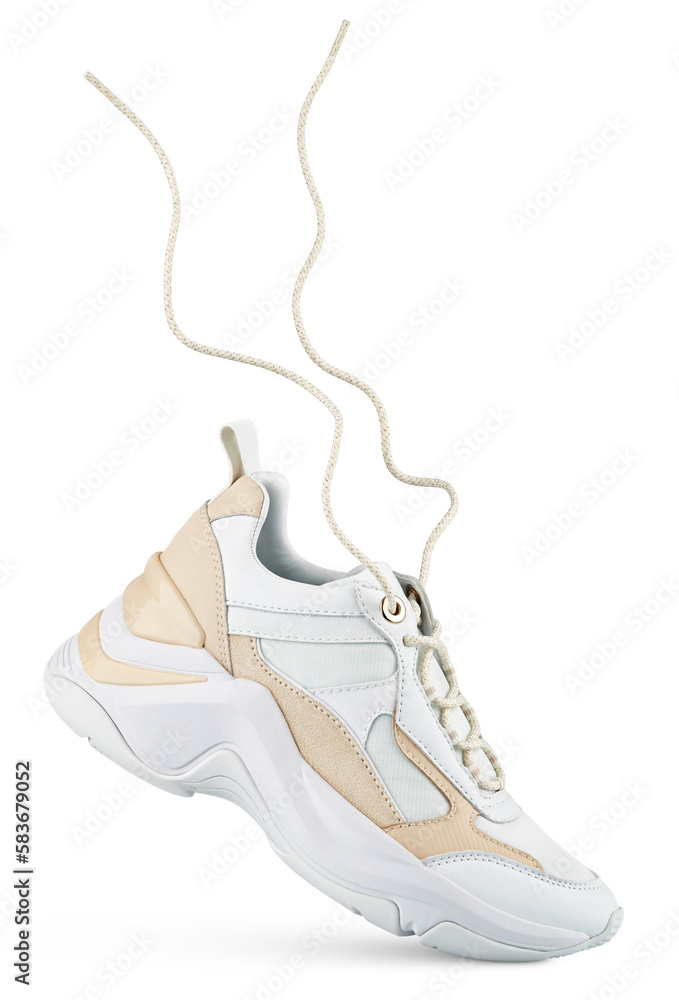 White sneaker with flying laces stands on the tip isolated on ...