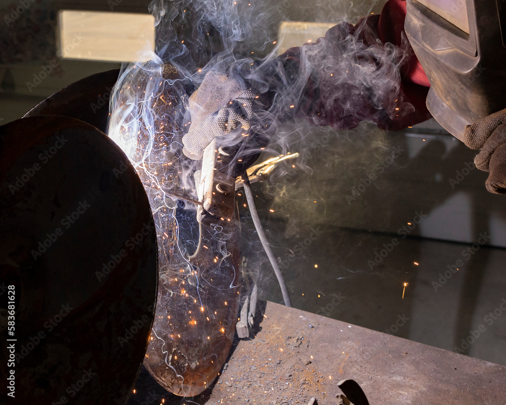 Close-up of a man's hands welding on a disc or coulter. Stock Photo ...