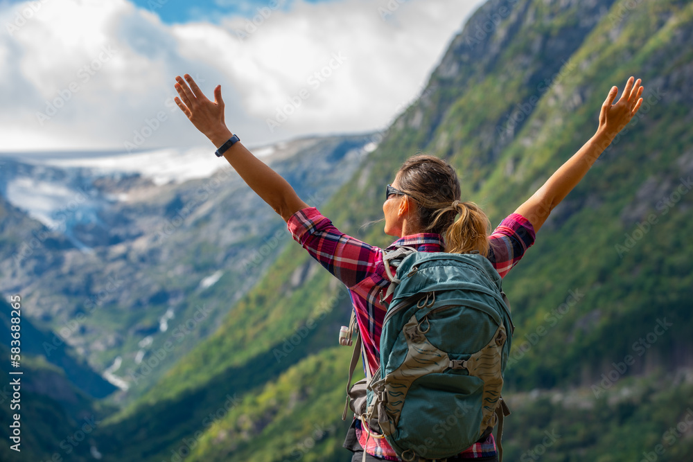 Fologefonna glacier. Odda Norway Woman Backpacker in Victory Pose with ...