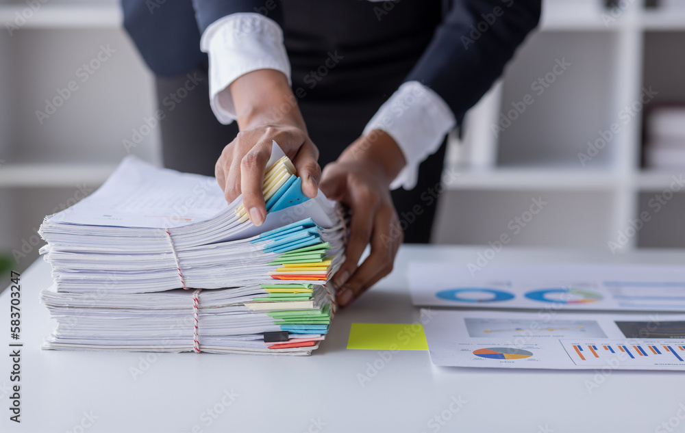 Business Employee Asian woman hand working in Stacks paper files for ...
